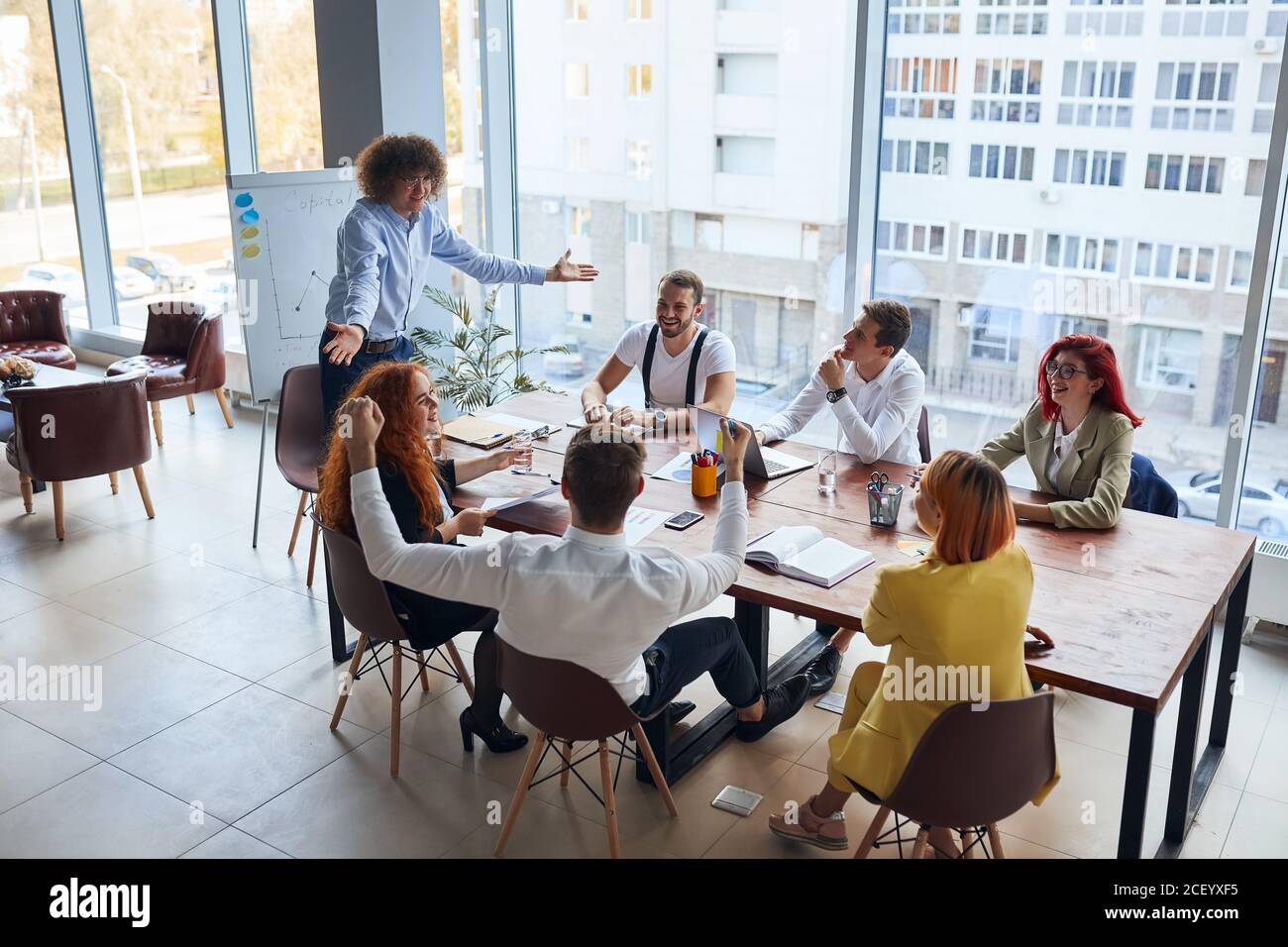 Co-workers women and men together working on new project, proffesional ...