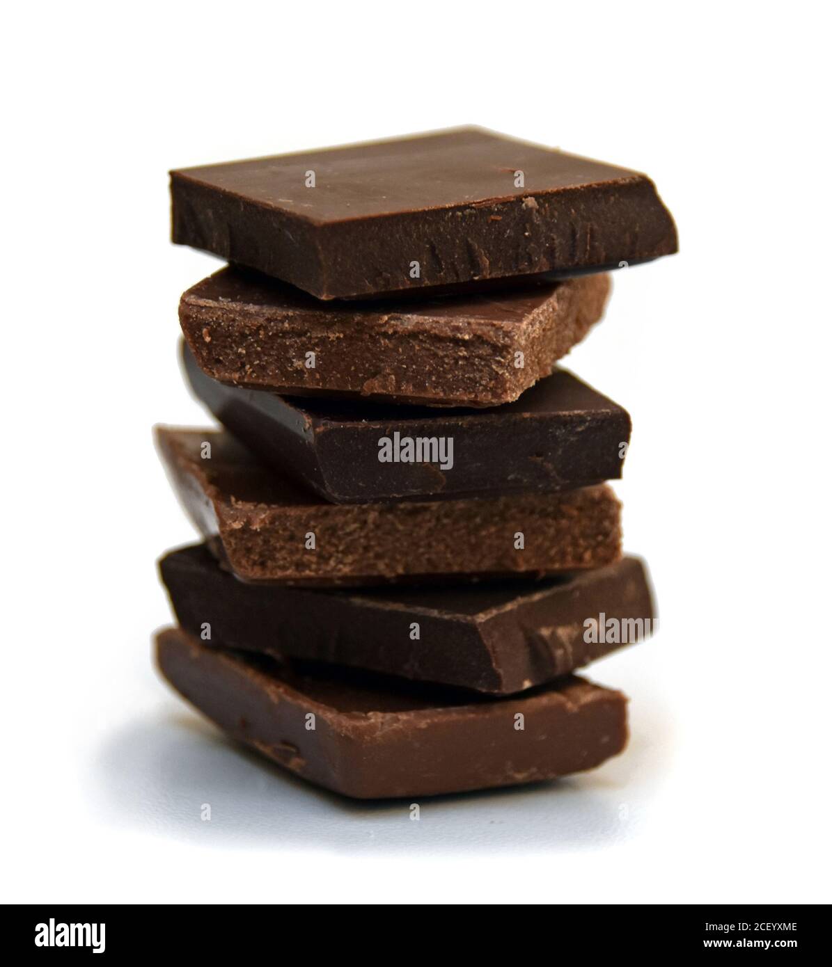 Milk and dark chocolate cubes. Chocolate stack on the white background ...