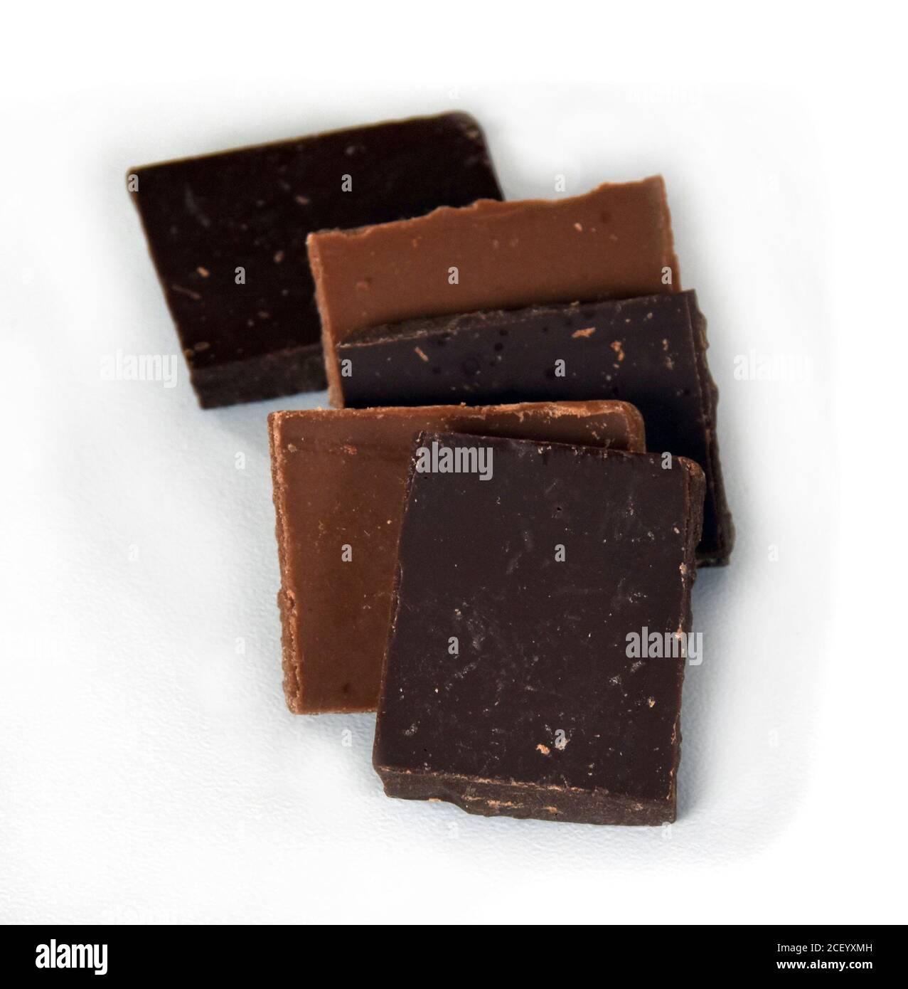 Milk and dark chocolate cubes. Chocolate stack on the white background ...