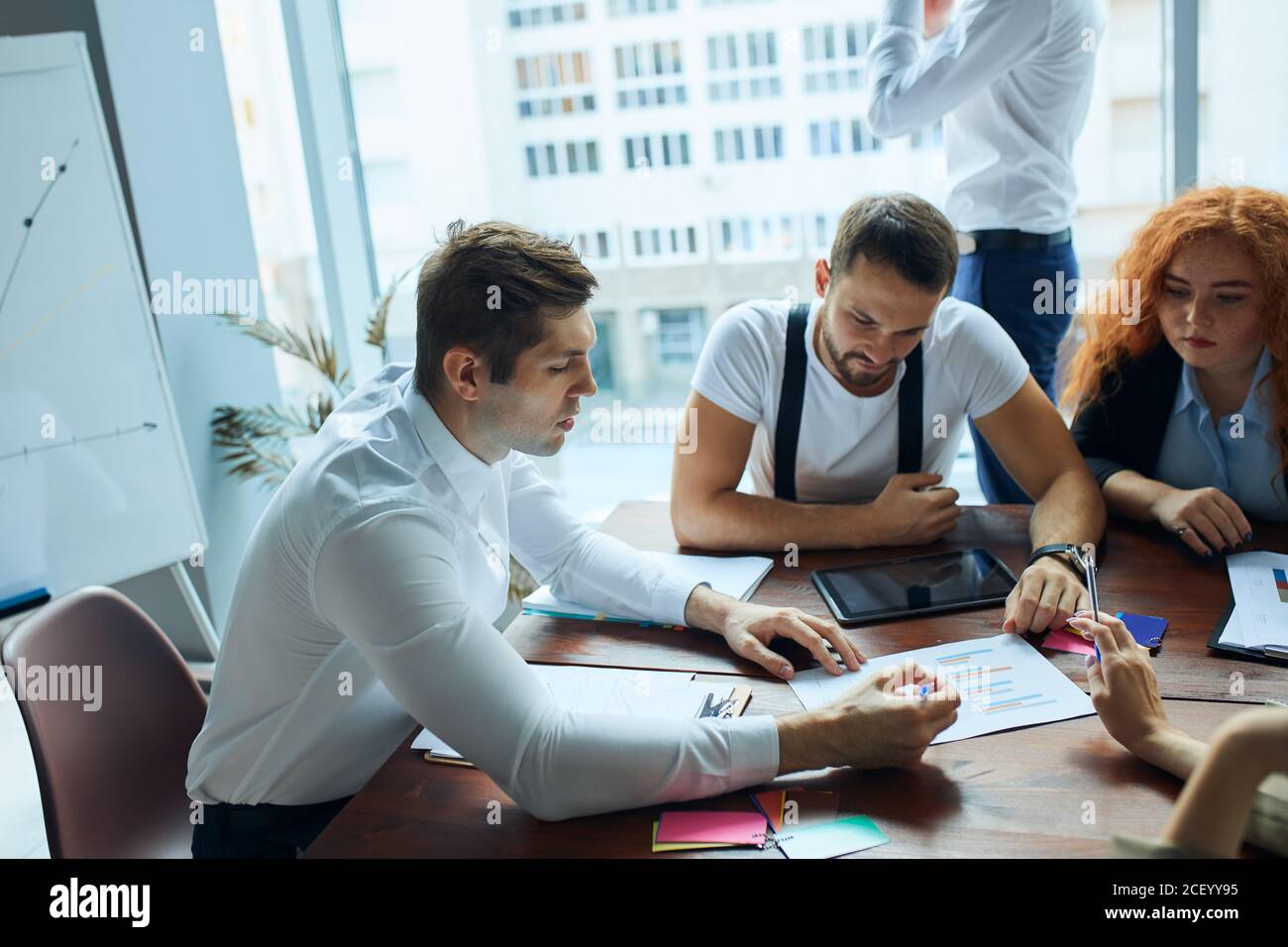 Young colleagues, caucasian business partners working as designers sit ...