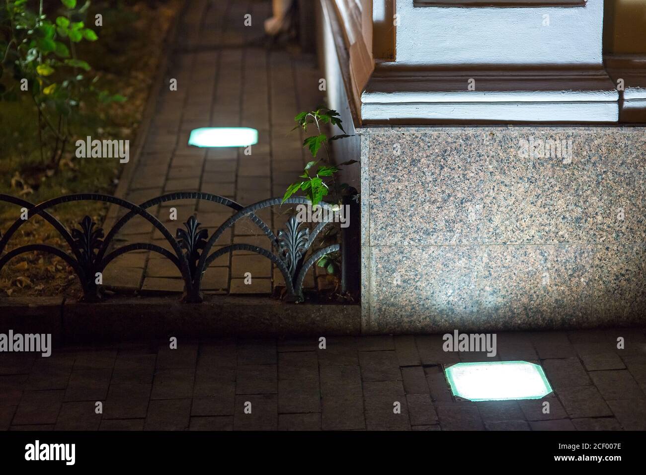 Built in grounding lantern in stone tile sidewalk illuminate granite ...