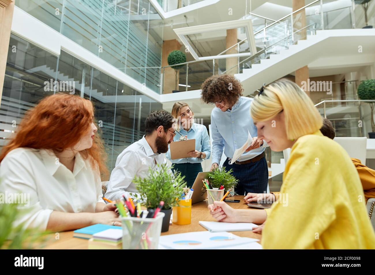 Pretty concentrated female beginner looks with attentive expressions ...