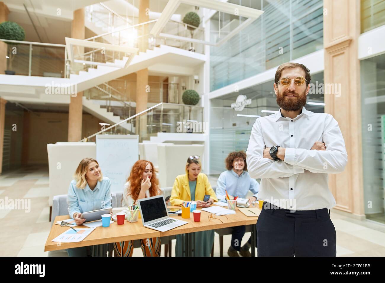 Self-assured satisfied man in stylish round glasses, wears formal ...