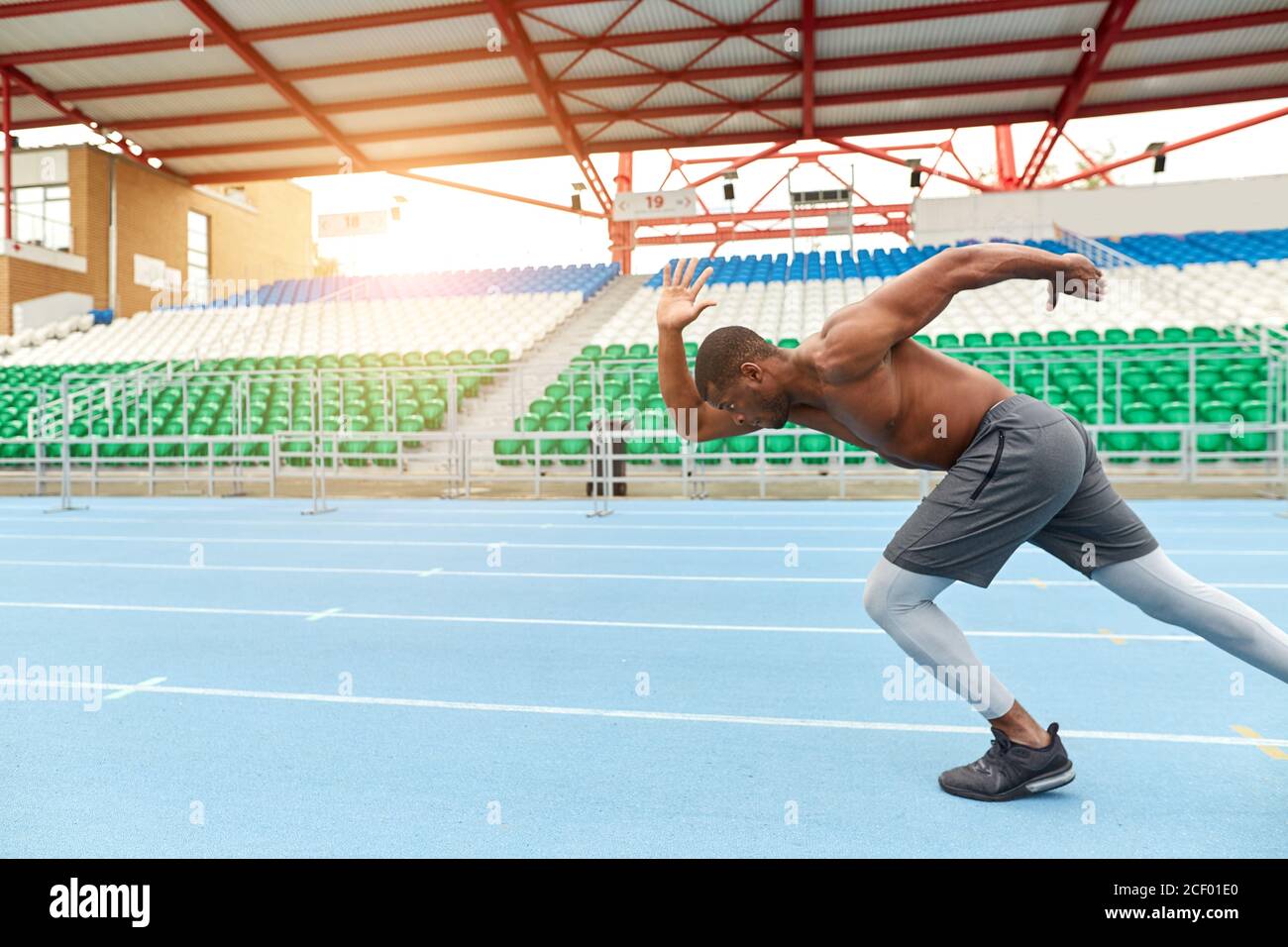 shirtless man running in the track., side view photo, copy space ,man ...