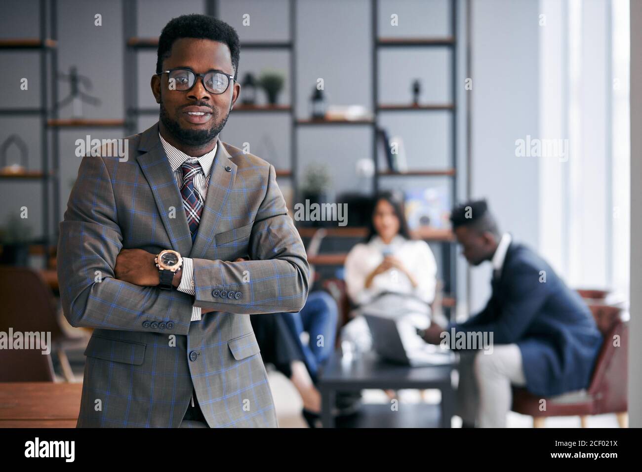 Personable man of african appearance wearing grey formal suit look at ...