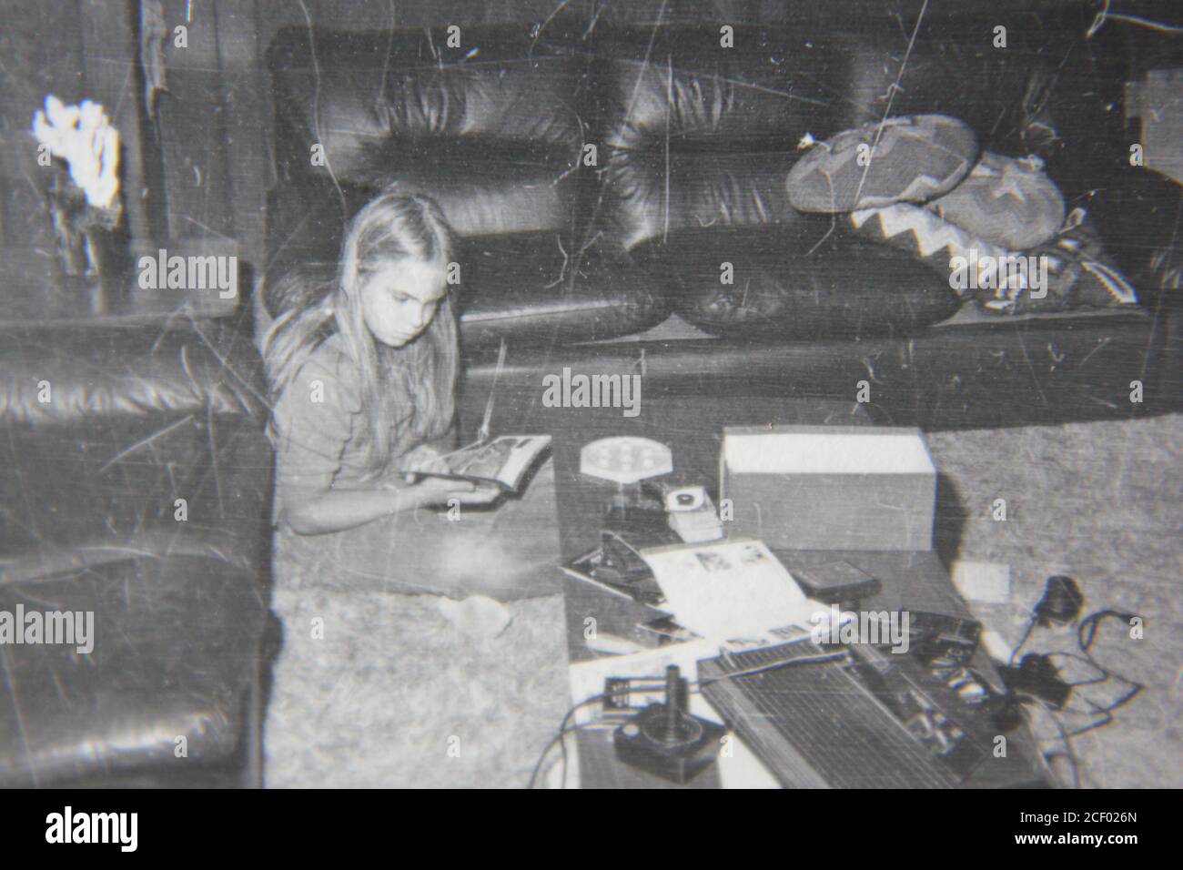 Fine 1970s vintage black and white photography of a young girl sitting ...