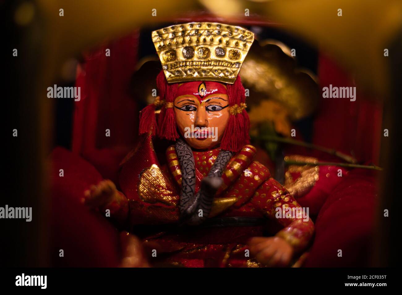 An idol of the Living Goddess Kumari is pictured inside the miniature ...