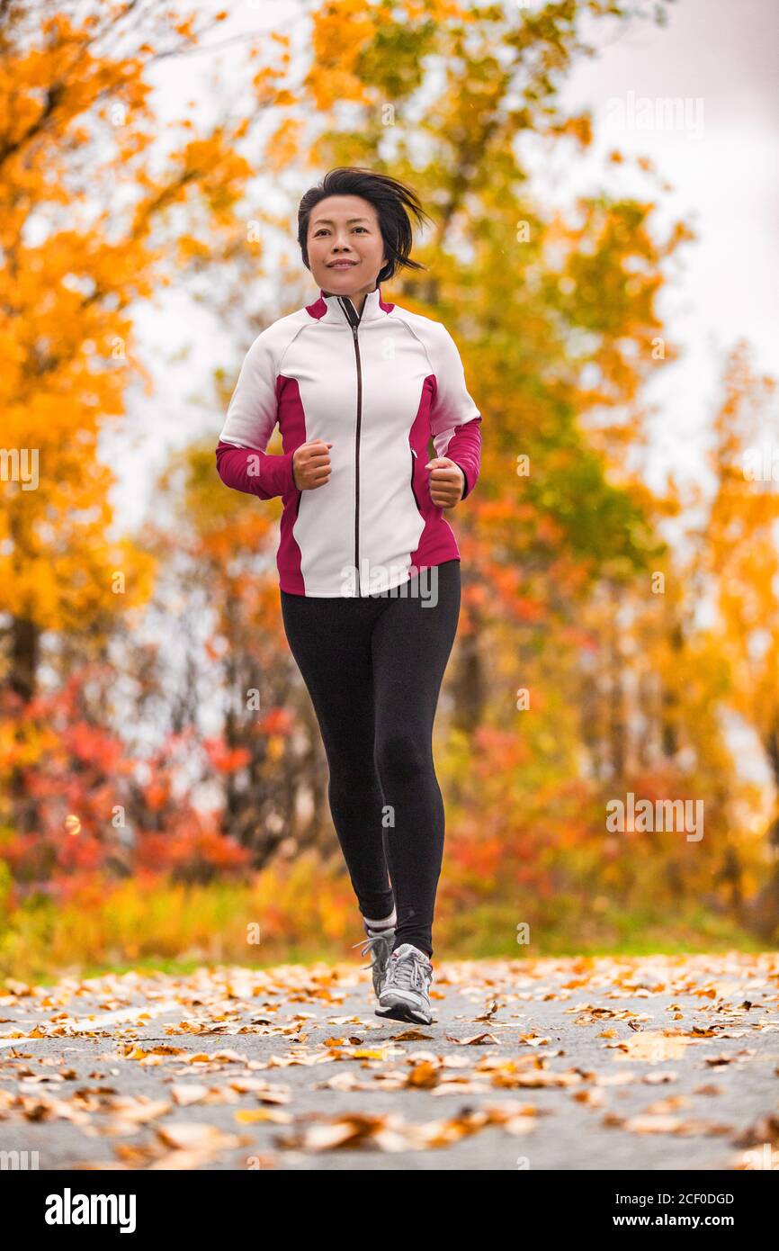 Autumn healthy middle aged mature woman exercising Stock Photo - Alamy