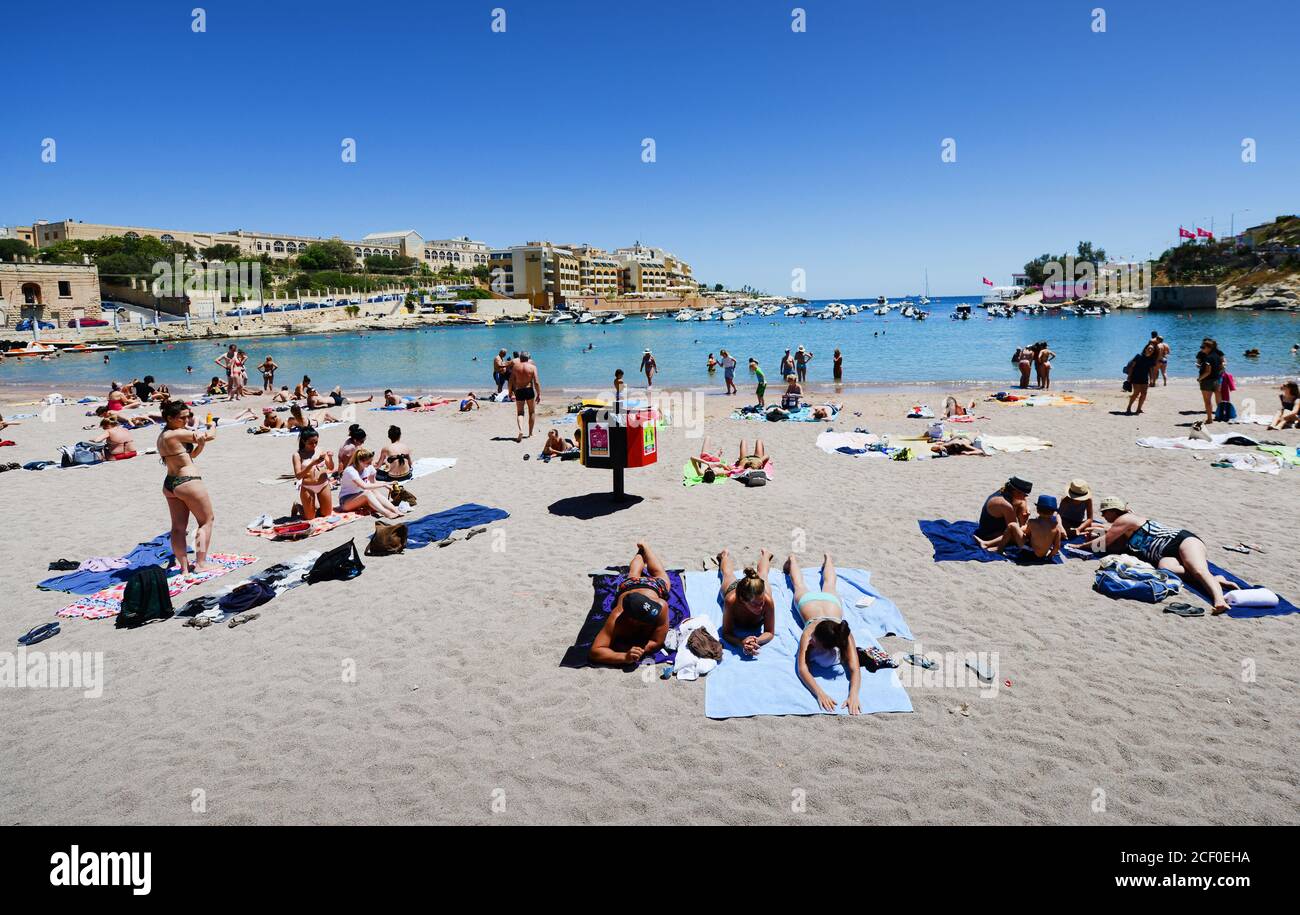 The vibrant beach of St George's Bay in St Julian's, Malta Stock Photo ...