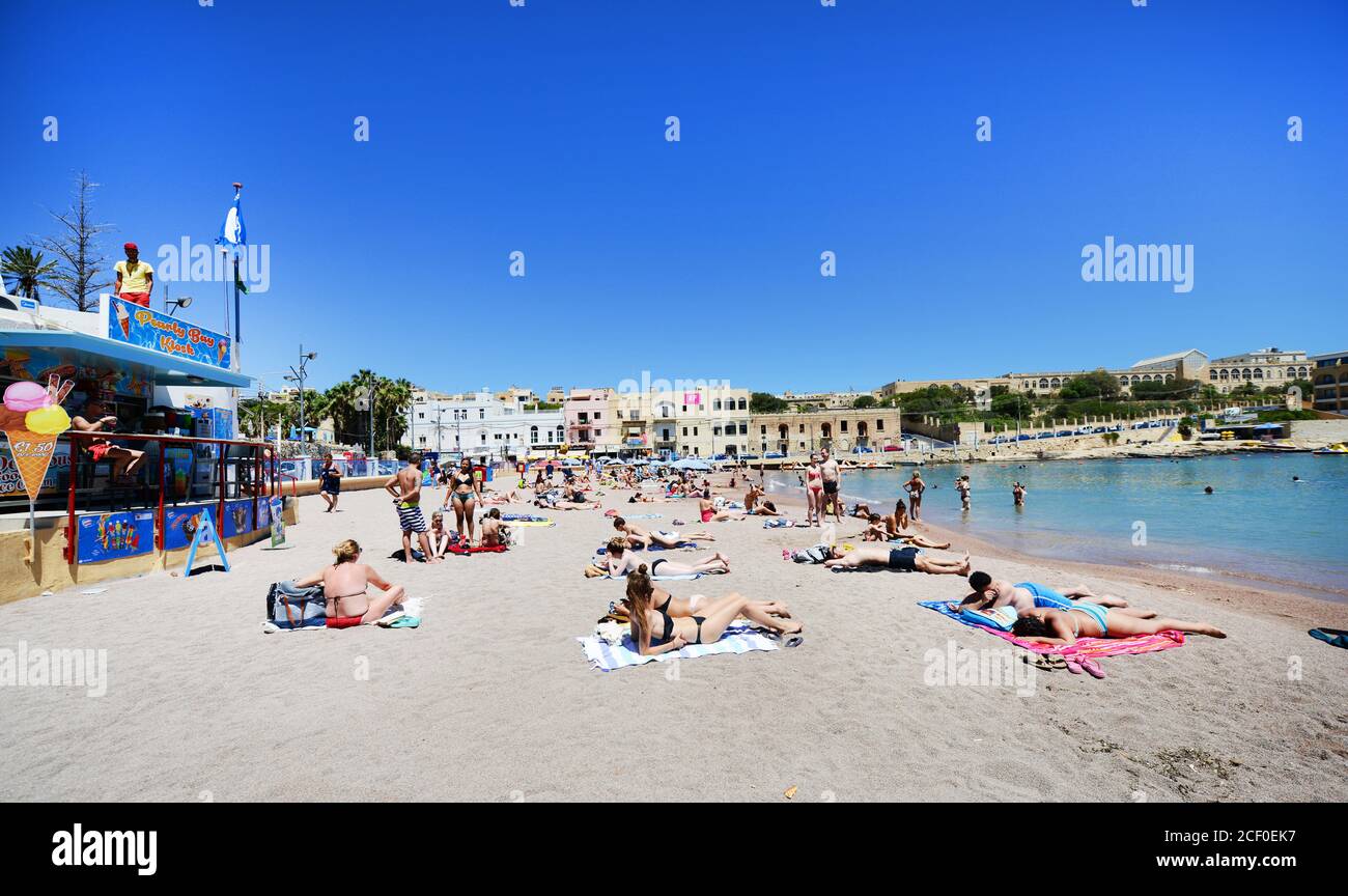 The vibrant beach of St George's Bay in St Julian's, Malta Stock Photo ...