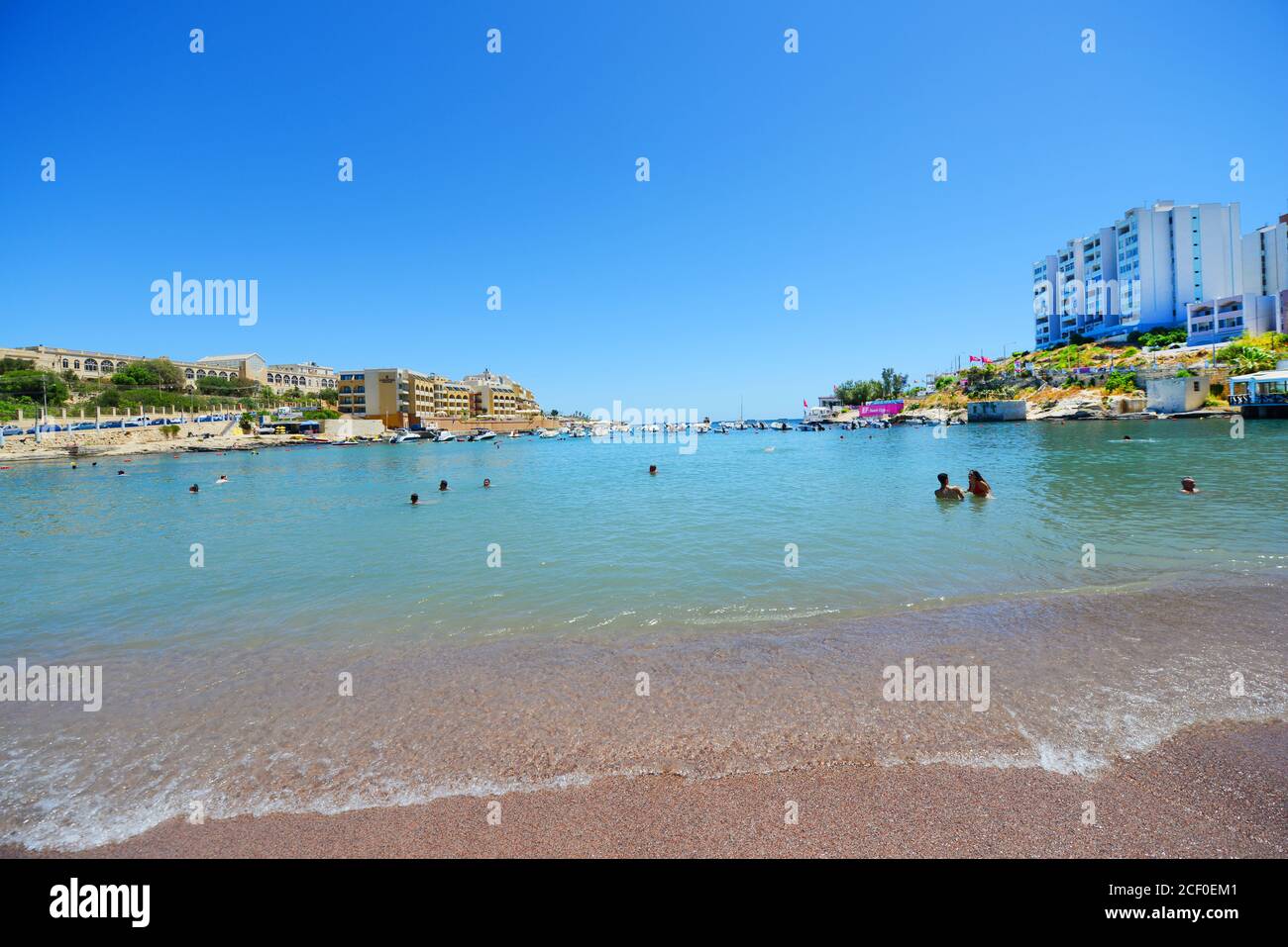 The vibrant beach of St George's Bay in St Julian's, Malta Stock Photo ...