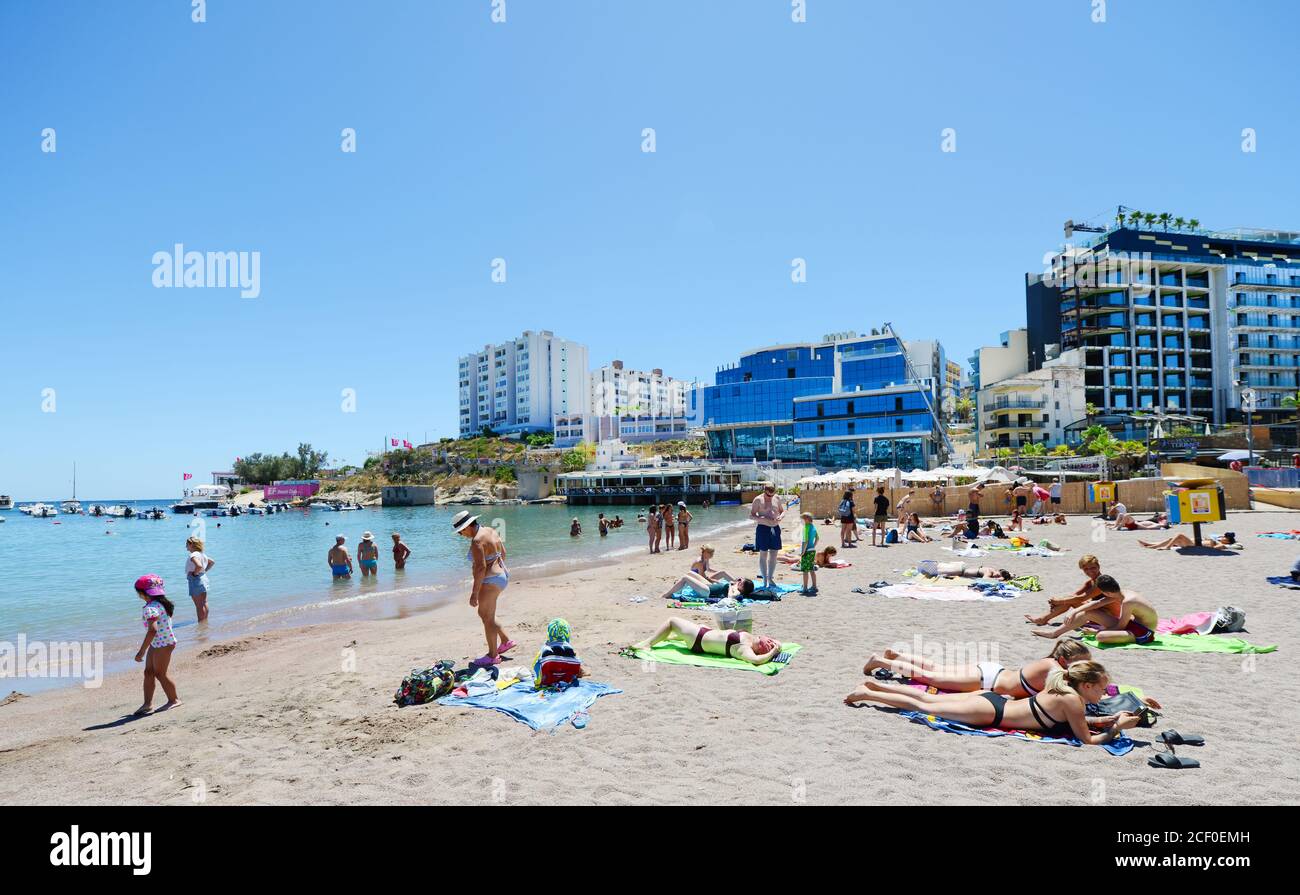 The vibrant beach of St George's Bay in St Julian's, Malta Stock Photo ...