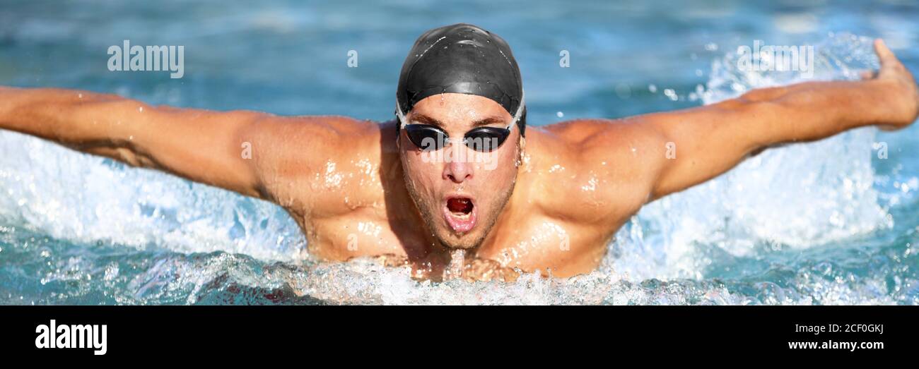 Fit swimmer athlete swimming butterfly stroke in swimming pool Stock ...