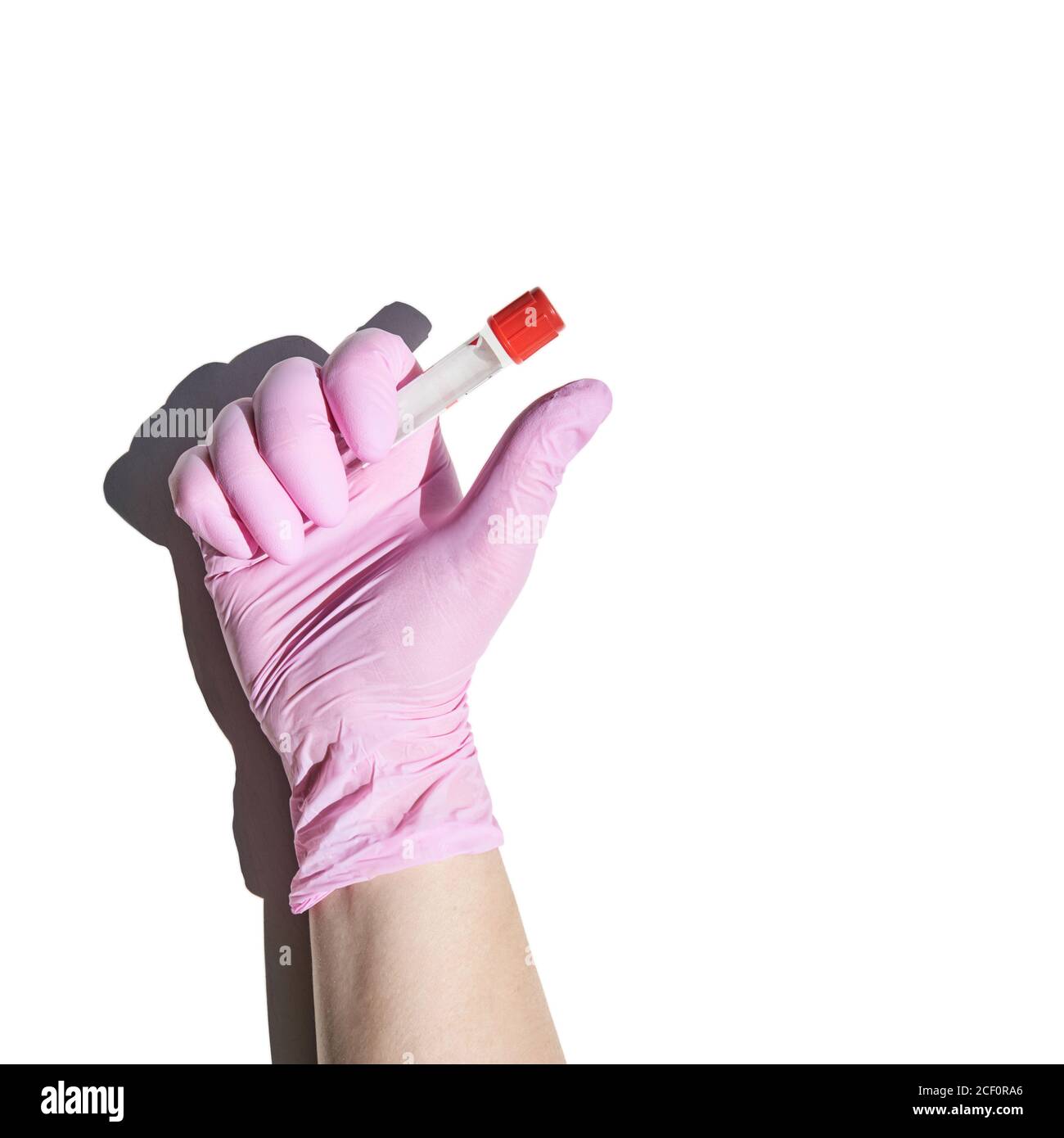 Hand in gloves holding test tube. Medical equipment Stock Photo - Alamy