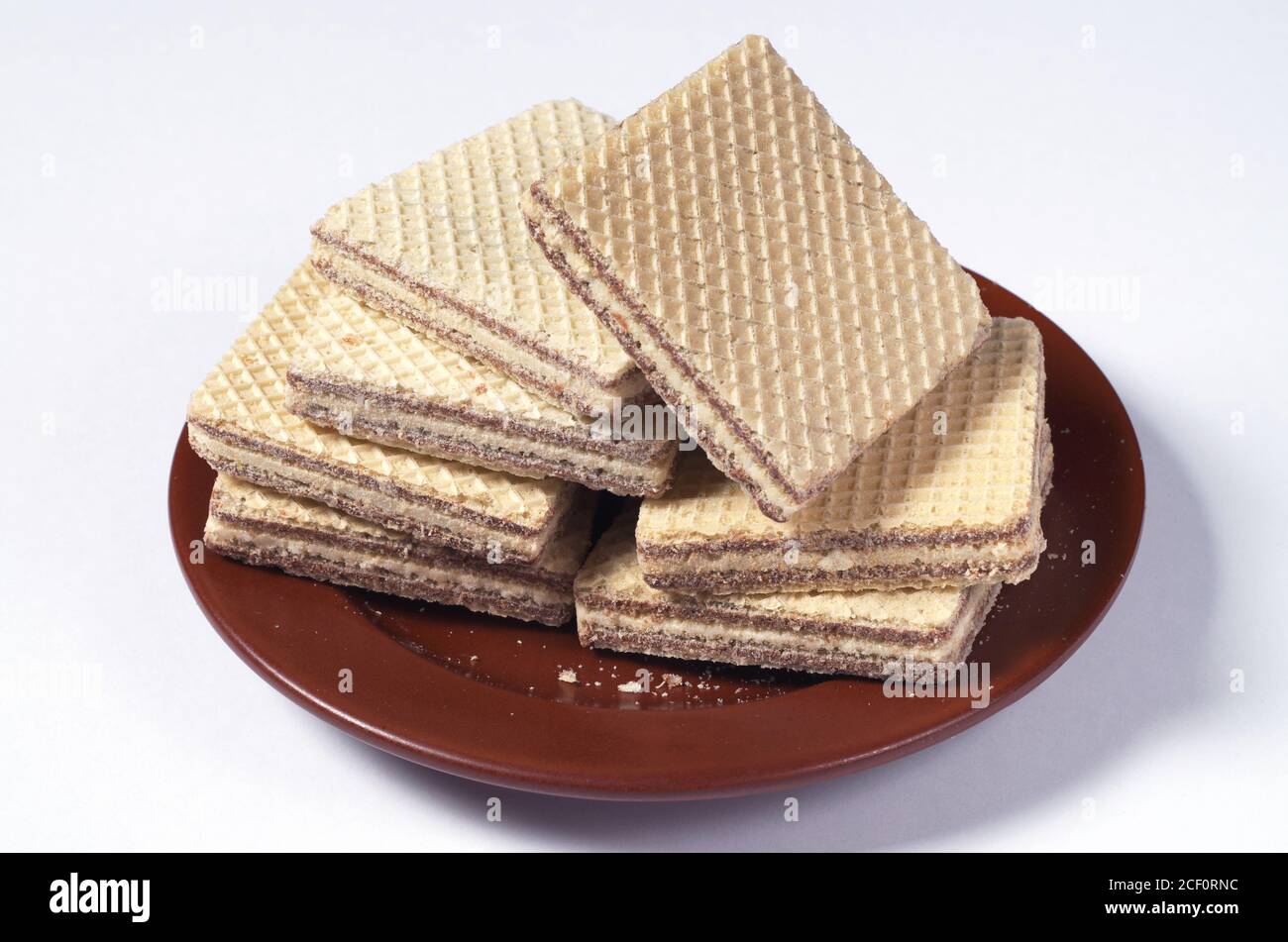 Wafers in plate on a white background Stock Photo - Alamy