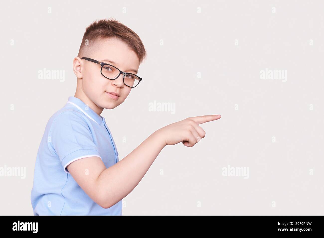 Pretty young student pointing. Elementary school children Stock Photo ...
