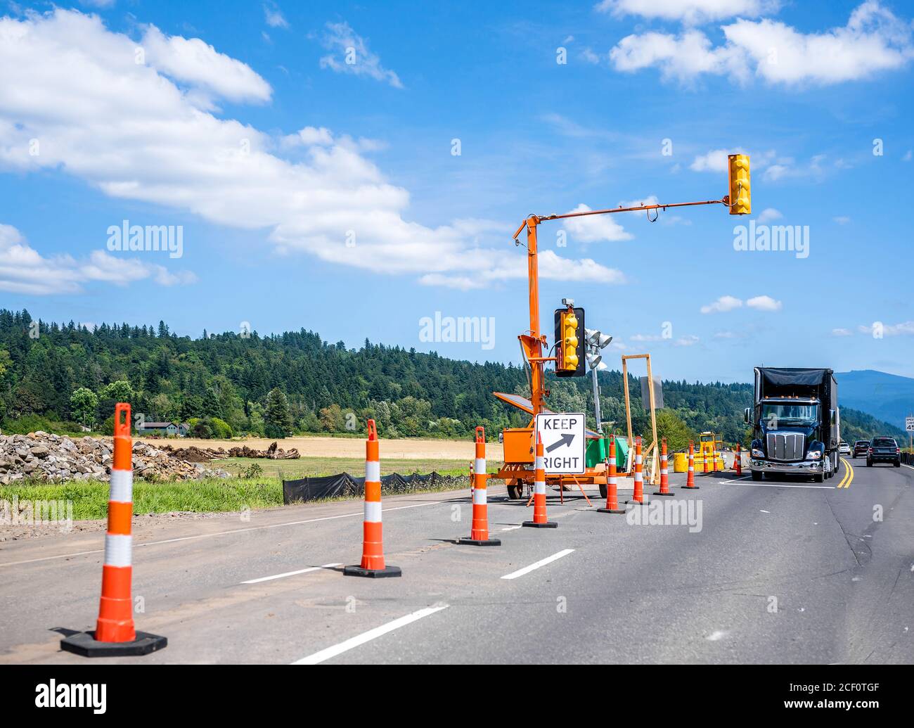 Black big rig industrial diesel day cab semi truck with semi trailer ...