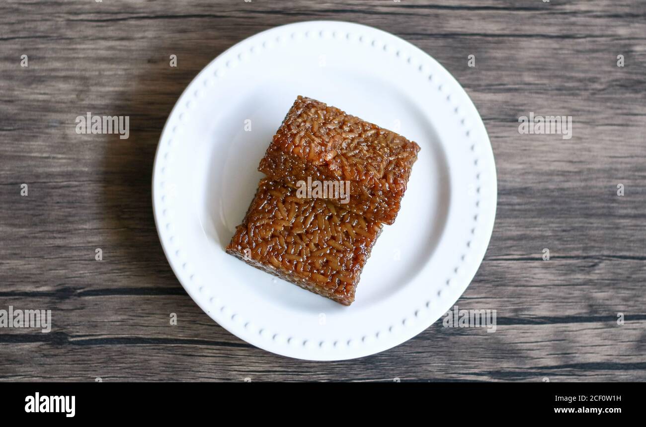 Wajik on wood background. Wajik is traditional snack made with steamed ...