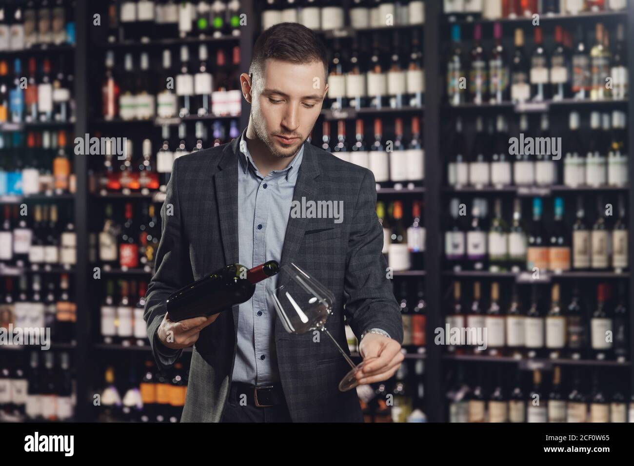 Professional sommelier pouring red hi-res stock photography and images ...