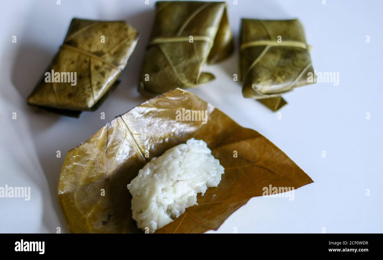 Fermented sticky (tape ketan) wrapped in guava leaves on white ...