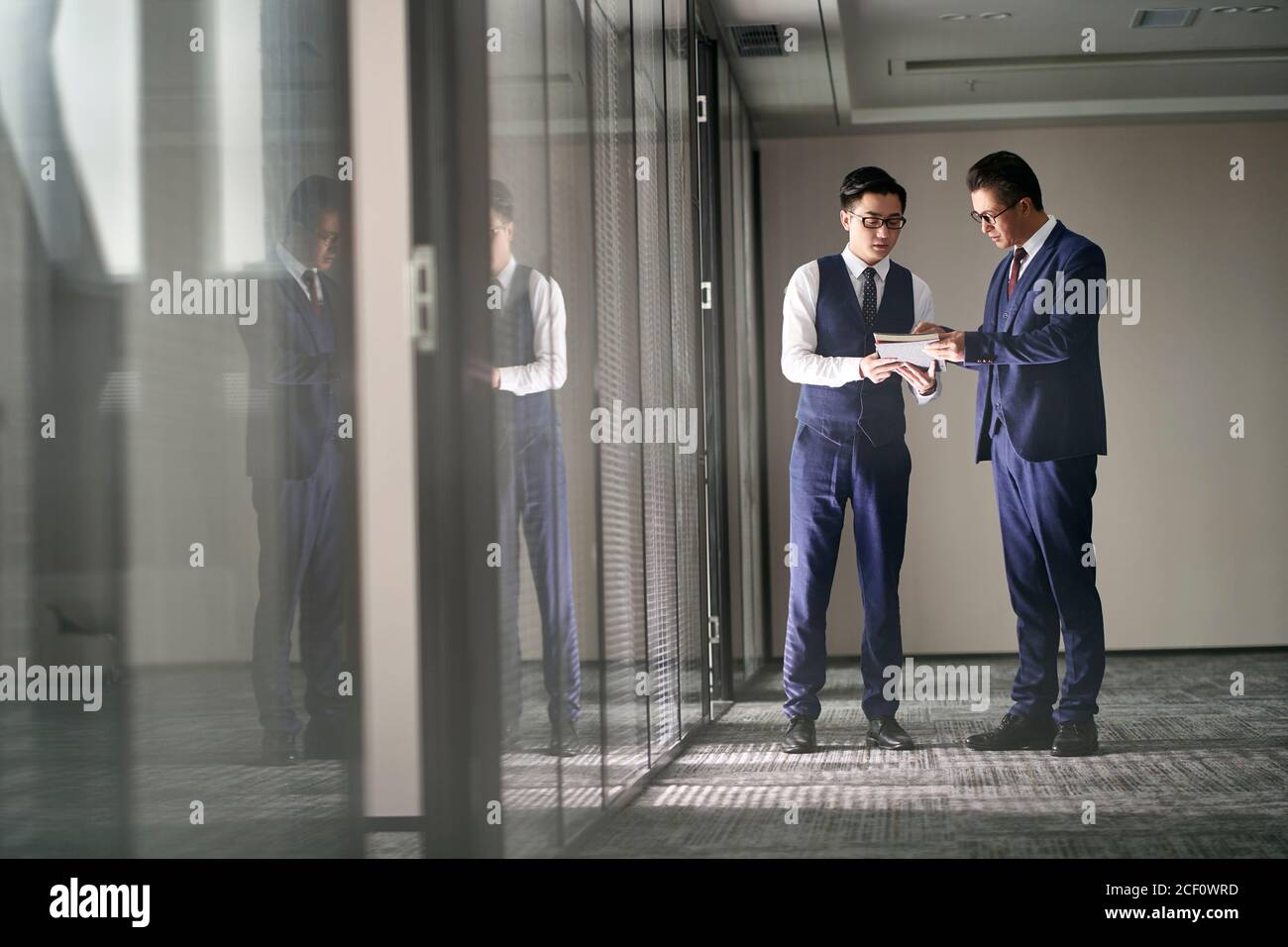 Two men standing together hi-res stock photography and images - Alamy