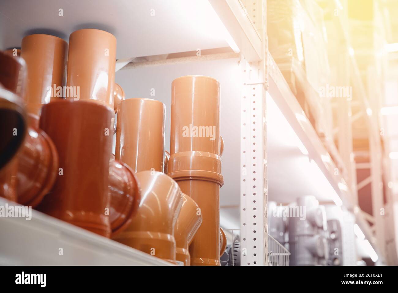 PVC plastic construction pipes for water are displayed in row on ...