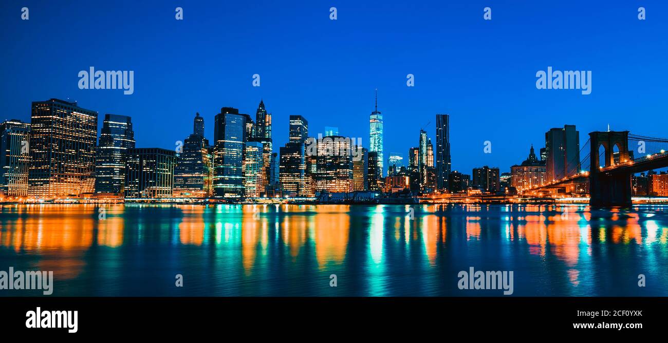 New York City Manhattan midtown at dusk with skyscrapers illuminated ...