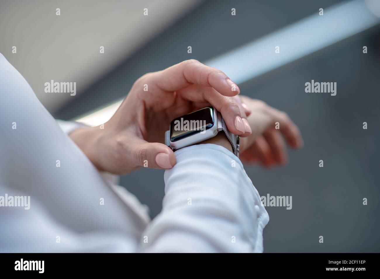 Close up picture of a womans hands touching a smartwatch Stock Photo ...