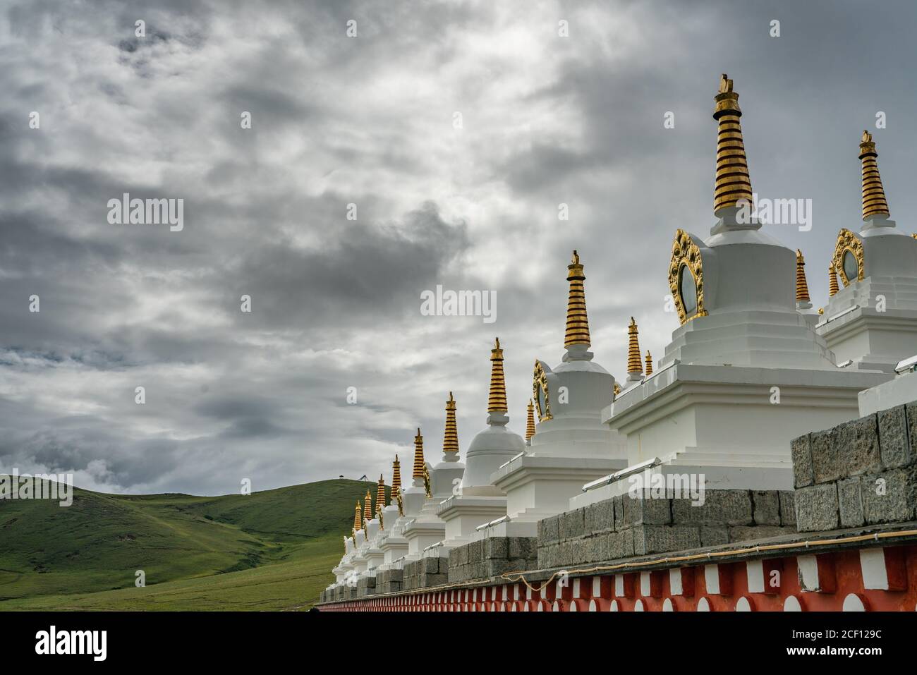 A row of white pagoda towers in Tibet, China Stock Photo - Alamy