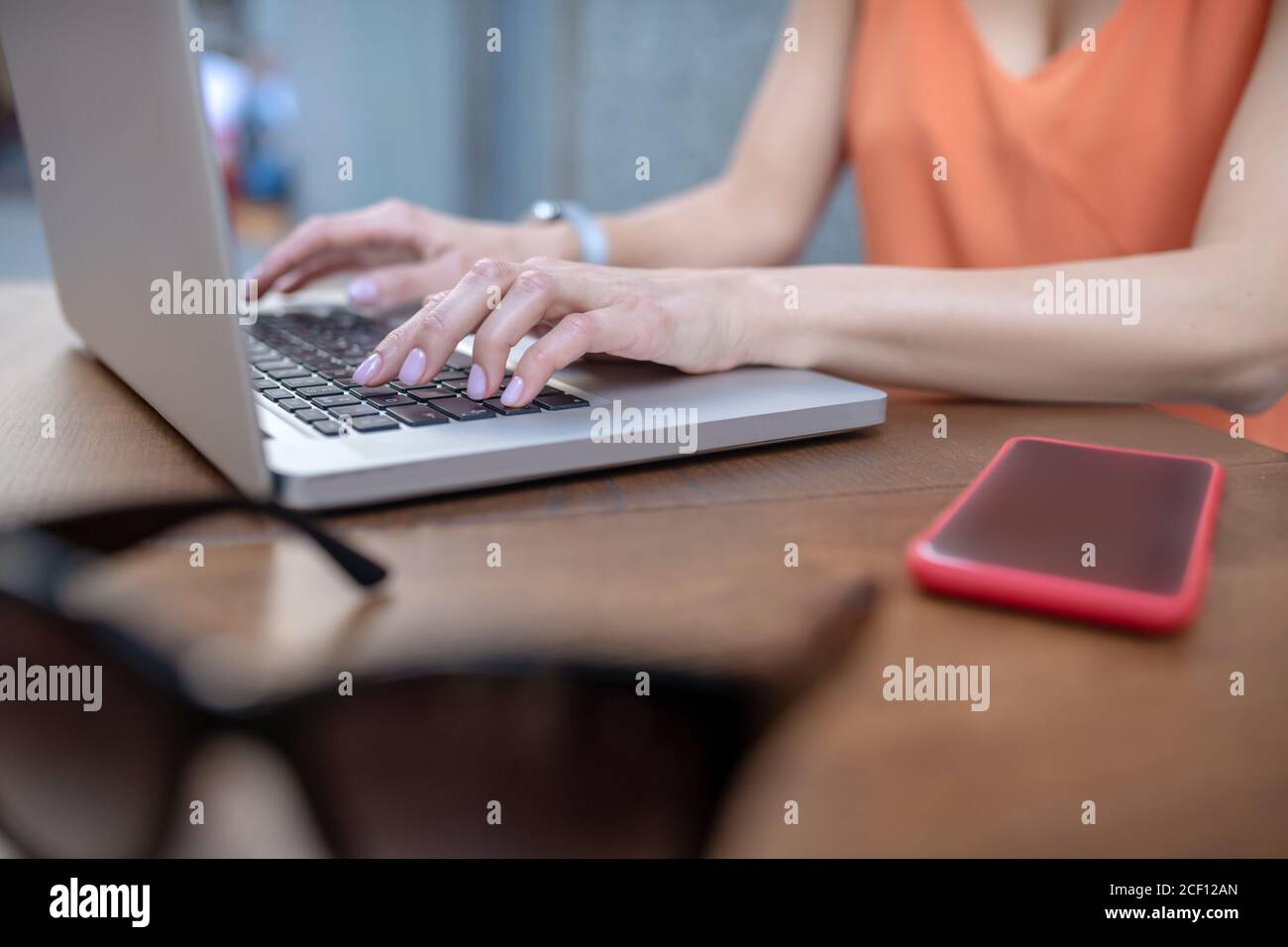 Close up picture of womans hands typing Stock Photo - Alamy