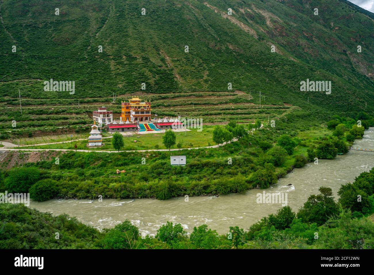 A tibetan village in mountain valley, summer time Stock Photo - Alamy
