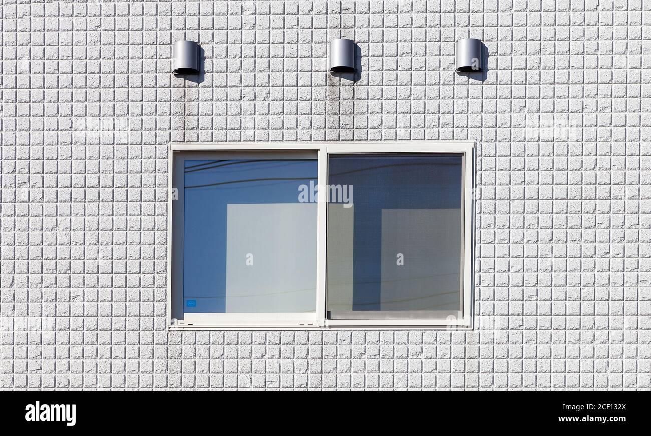 Wall of building with windows Stock Photo - Alamy