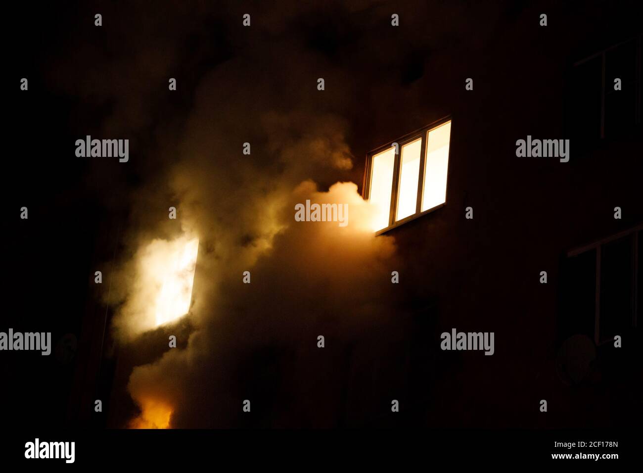 a residential apartment building is on fire at night Stock Photo - Alamy