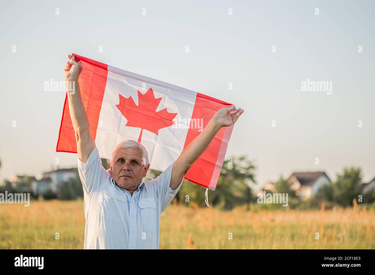 Canadian man wave flag hi-res stock photography and images - Alamy