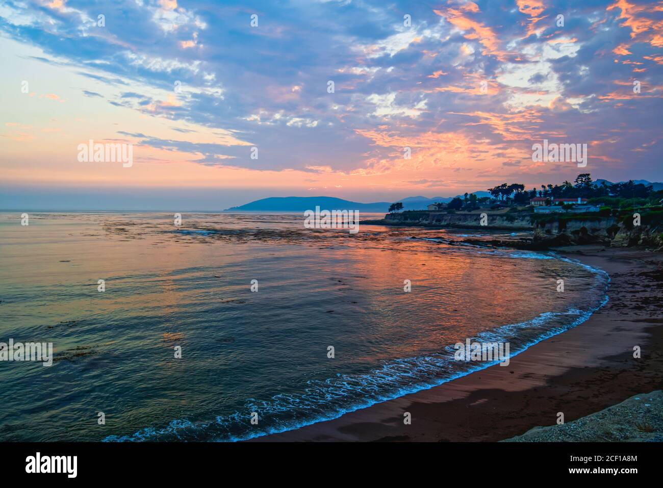 Tropical beach sunset in beautiful blue and pink colors Stock Photo - Alamy