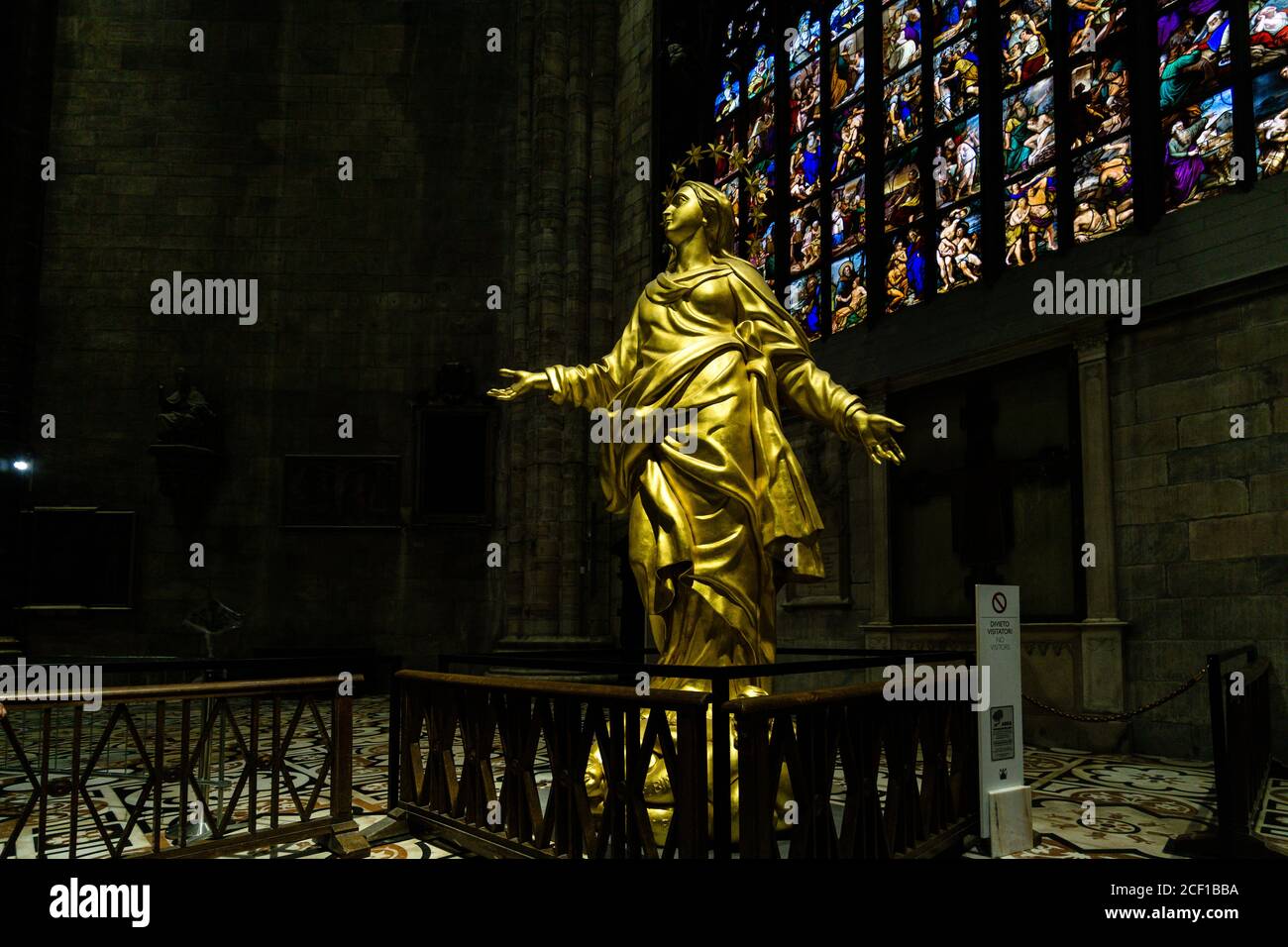 Golden Virgin Mary statue inside Duomo di Milano in Milan, Italy Stock ...