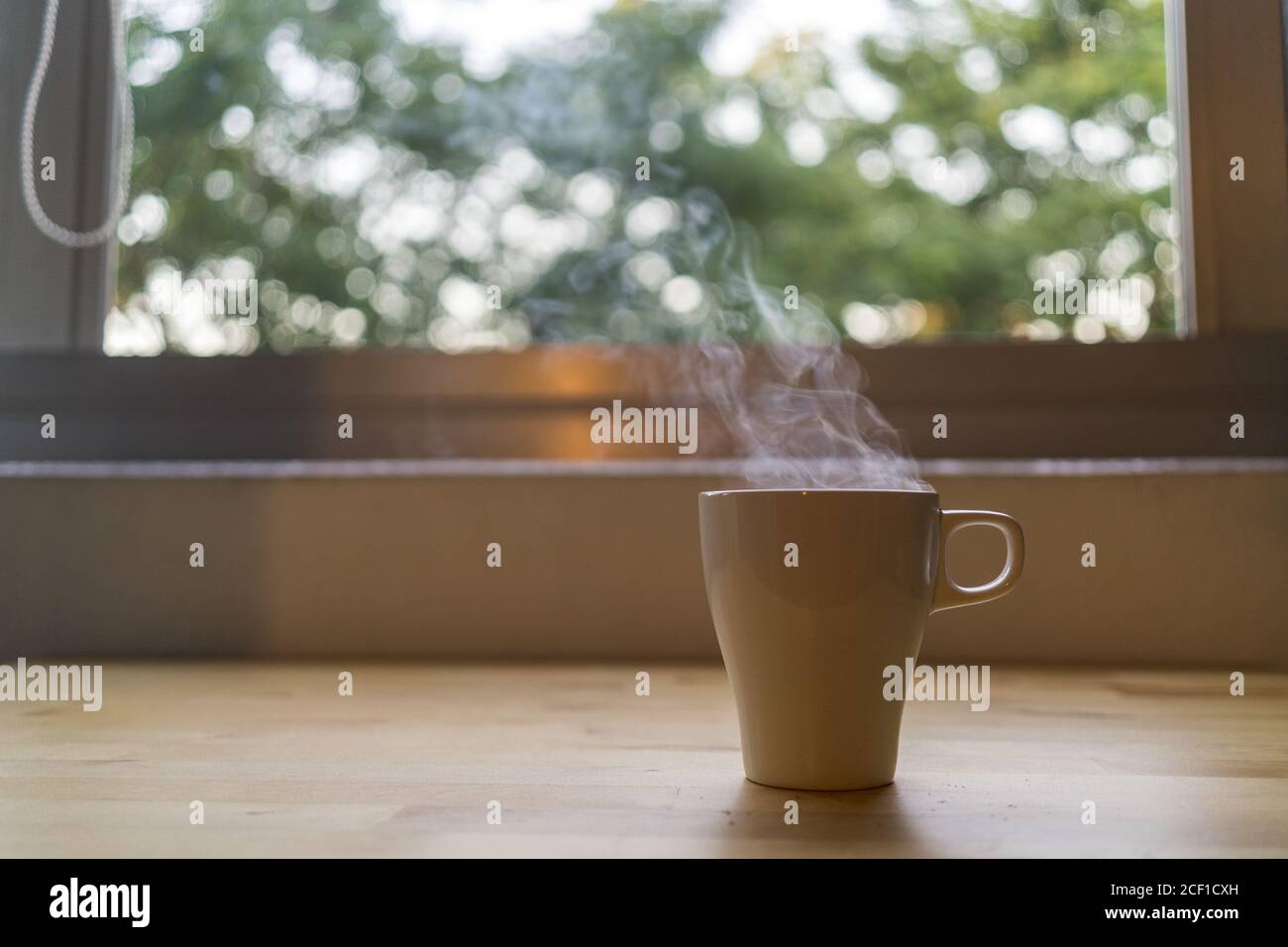 Foam comming out of a coffee mug Stock Photo - Alamy