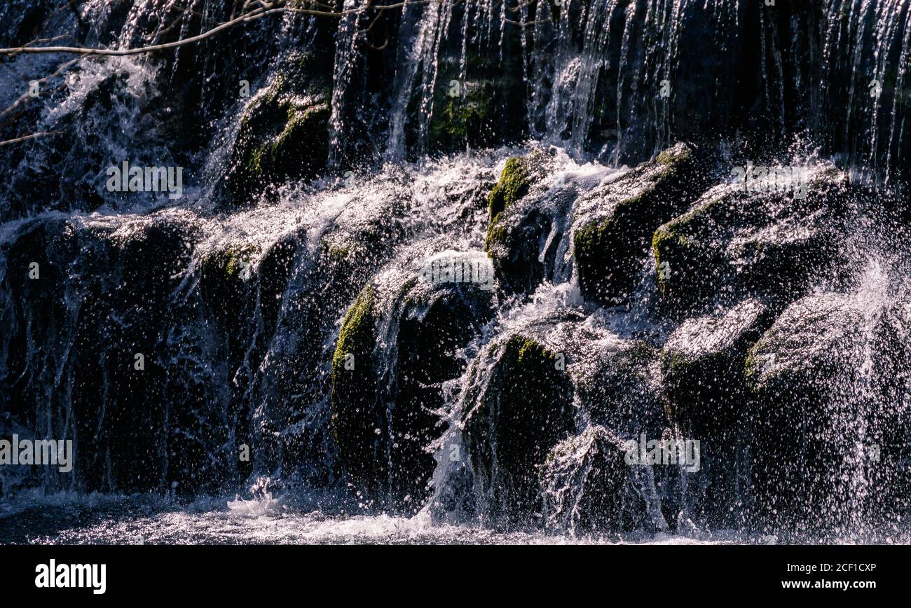 Beautiful waterfall with water streaming down from the cliff Stock ...