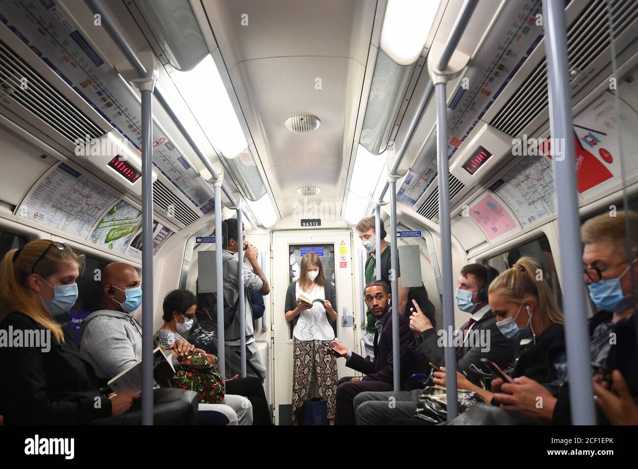 Passengers wearing face masks on jubilee line hi-res stock photography ...