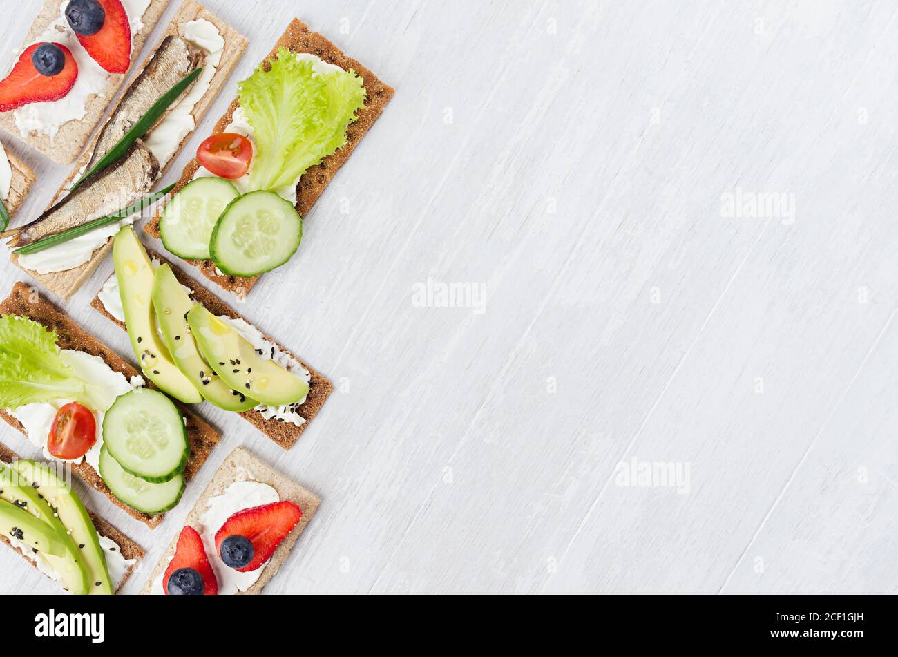 Healthy dietary assortment of chips rye flat toasts with fresh ...