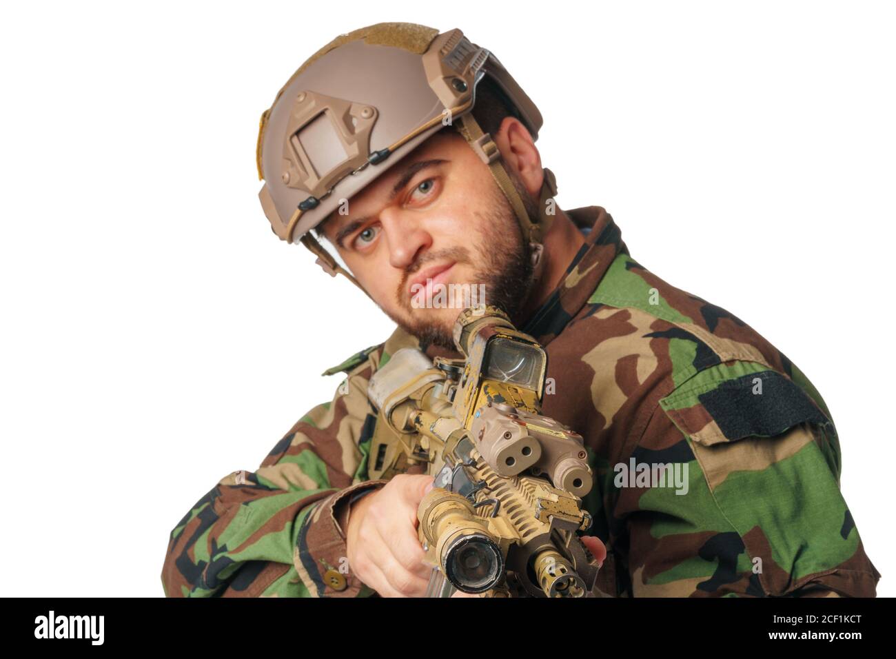 Airsoft player aiming with his rifle isolated on white Stock Photo - Alamy