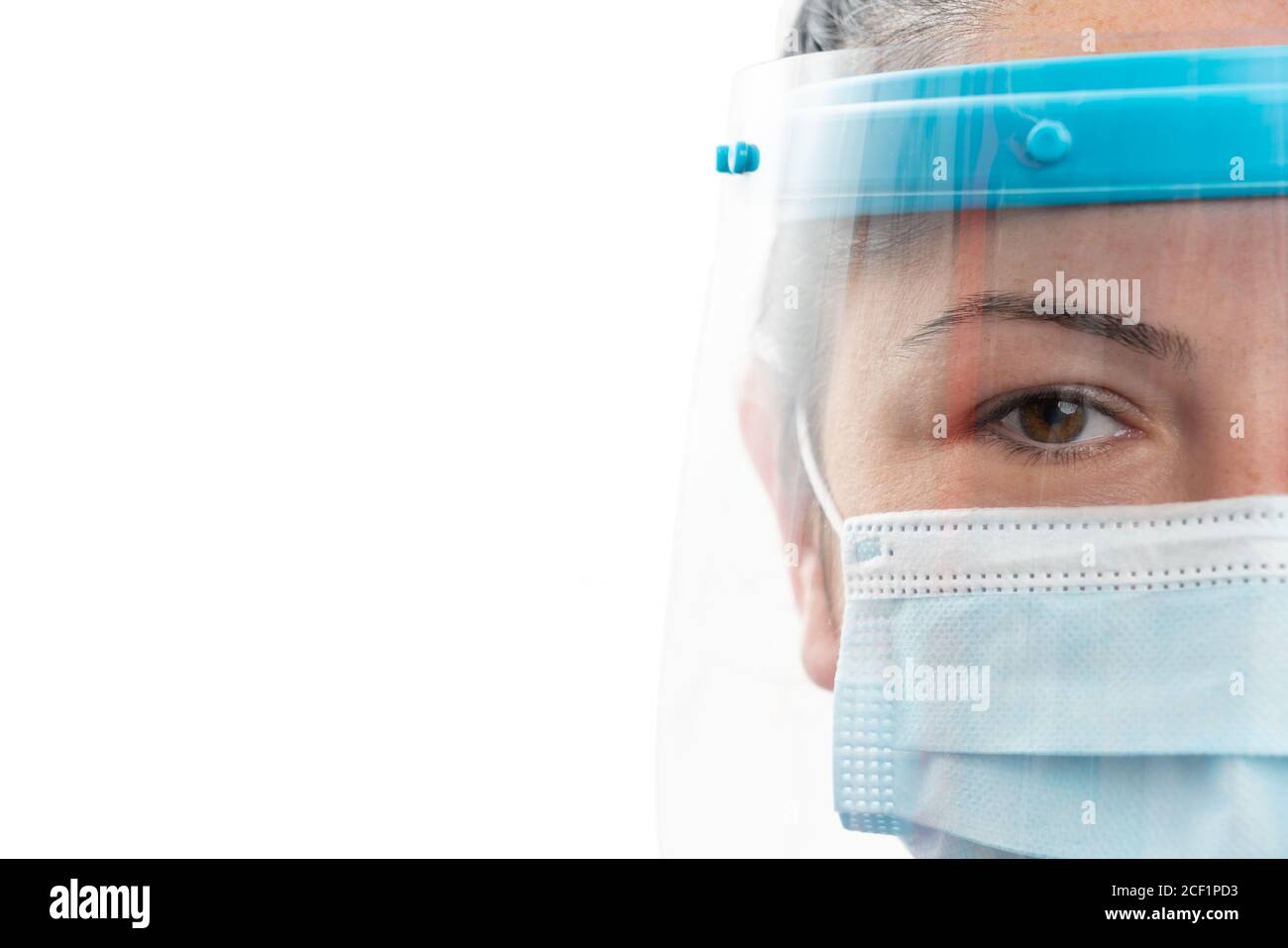 Half face close-up of adult woman model wearing transparent shield and ...