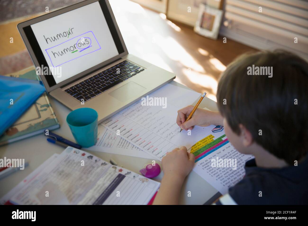 Child write laptop hi-res stock photography and images - Alamy