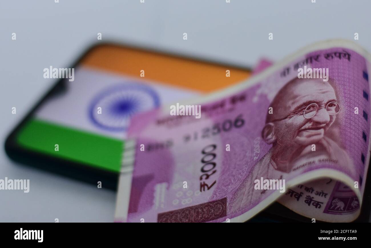 In this photo illustration two thousand rupee notes on display with an ...