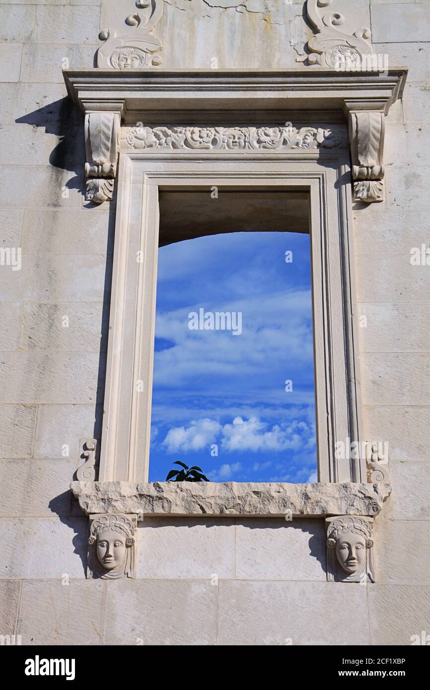 Ancient Roman ruins in Zadar, Croatia. Detail of white marble window ...
