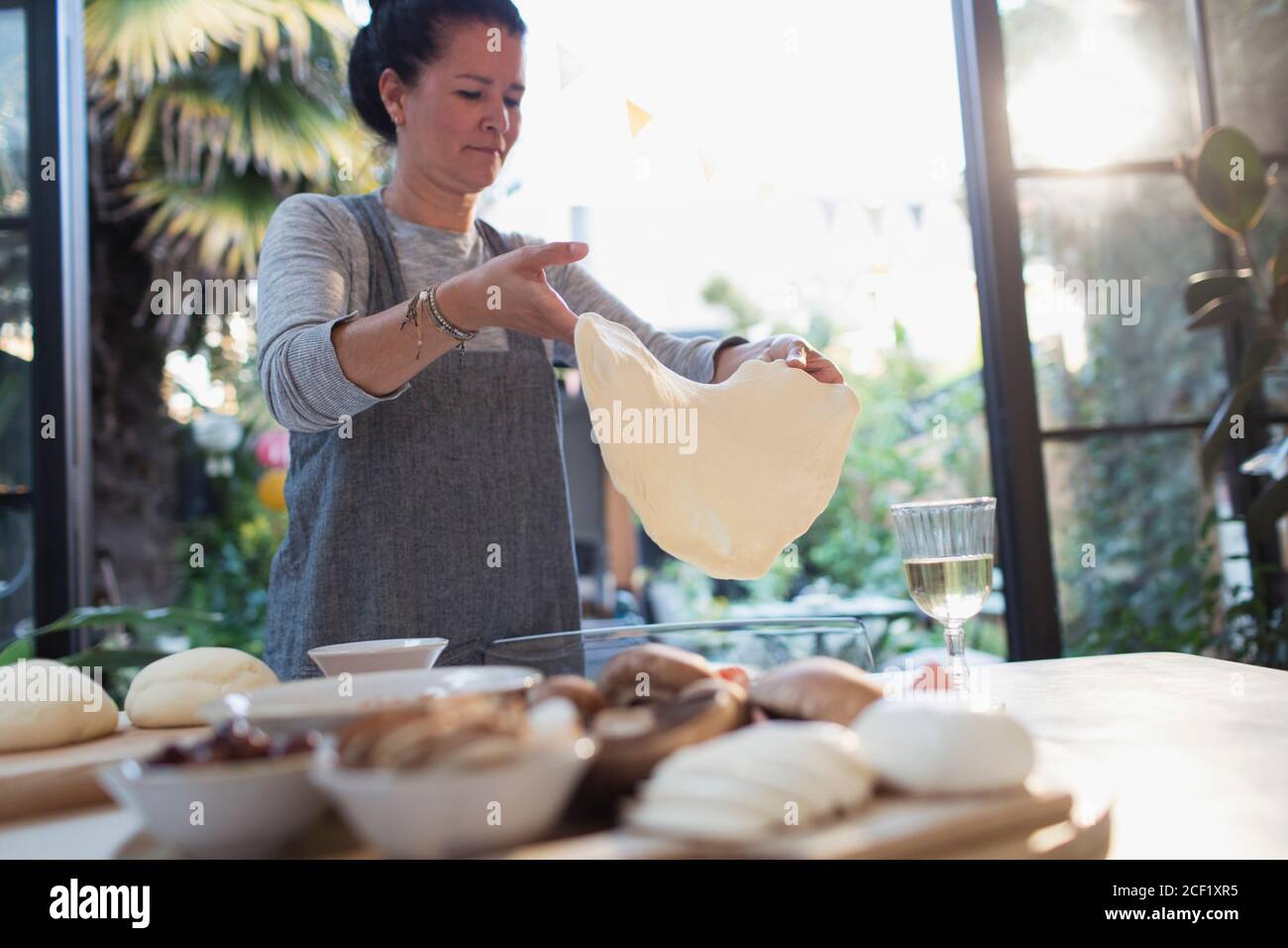 Stretching pizza dough hi-res stock photography and images - Alamy