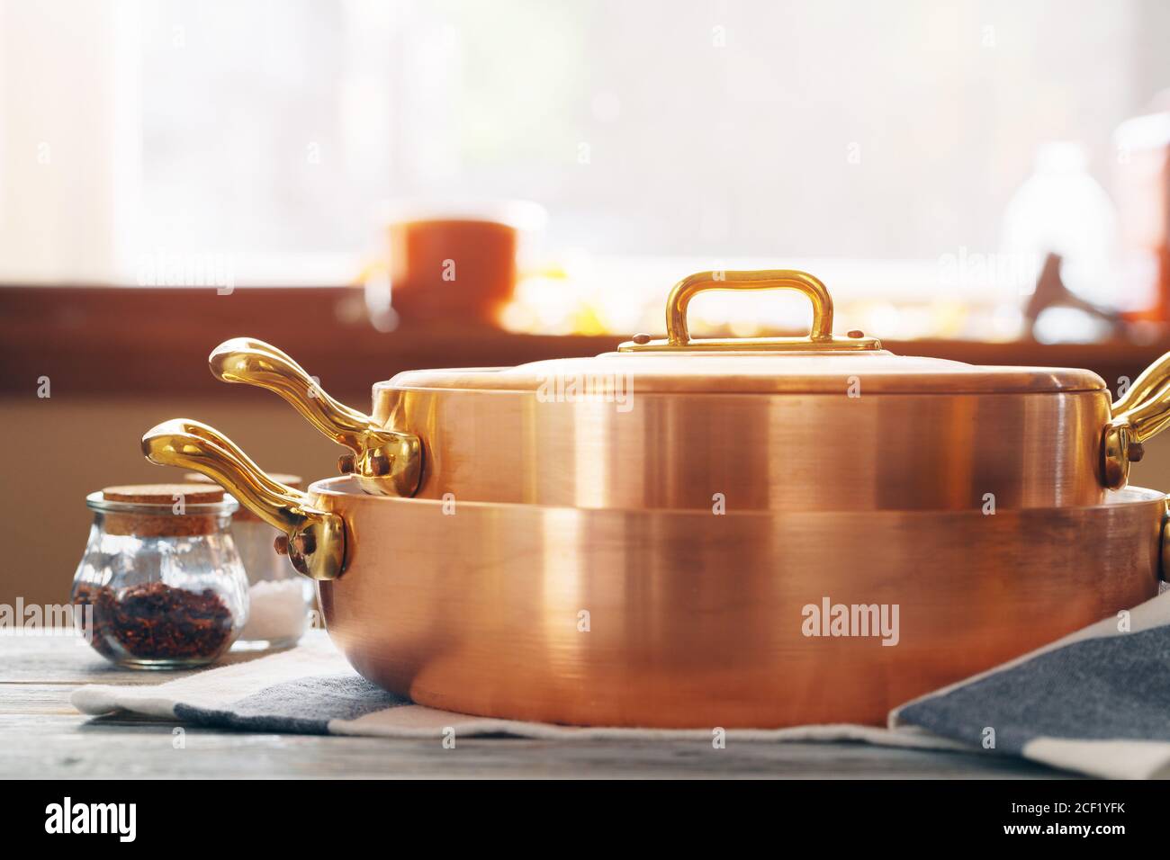 New copper cookware for professional kitchen close up Stock Photo - Alamy