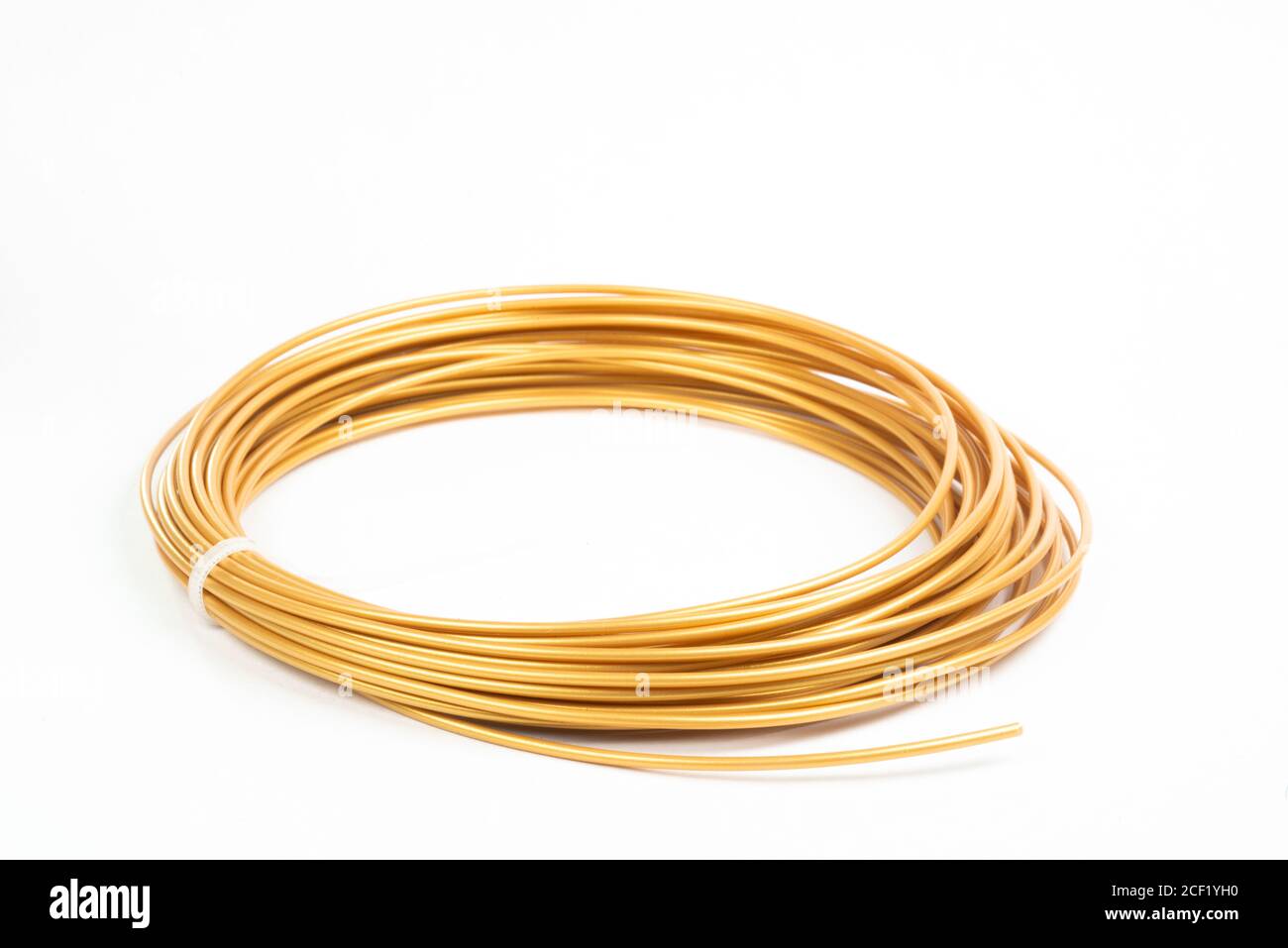 Top view of golden rolled filament 3D pen PLA isolated on white ...