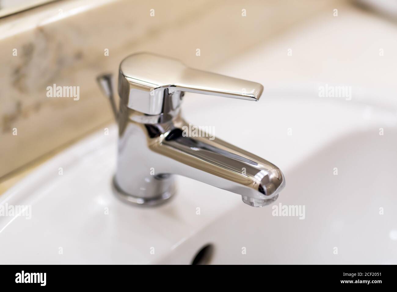 Shiny stainless steel faucet with chrome water tap Stock Photo - Alamy