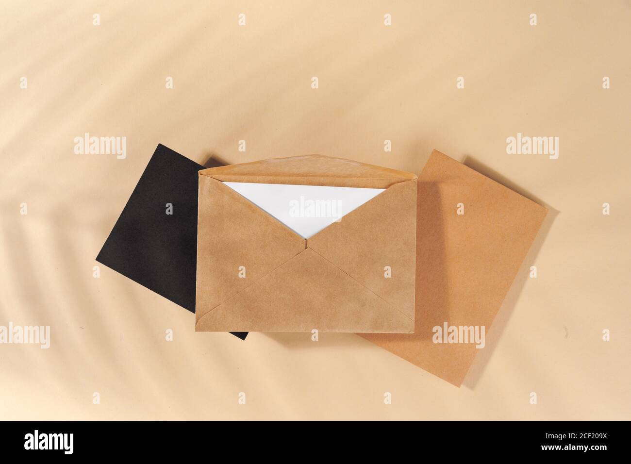 Craft paper letter on beige background top view Stock Photo - Alamy